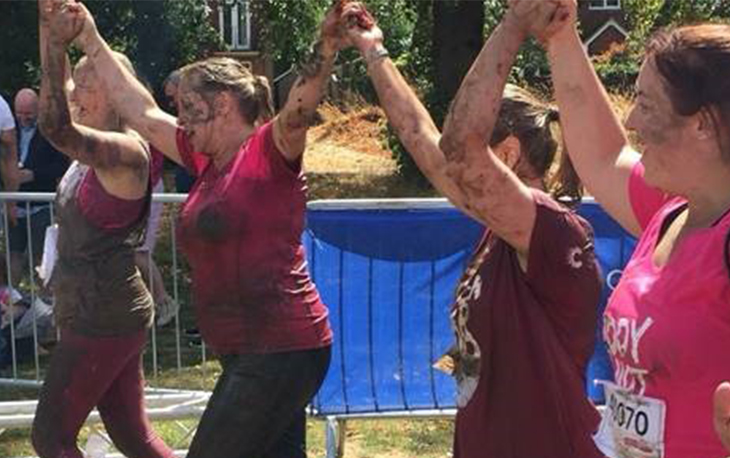 Getting muddy for Cancer Research - Funeral Partners